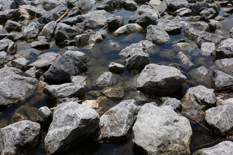 Granite Rocks in Water with Perfect Sun Stock Image - Image of rocks ...