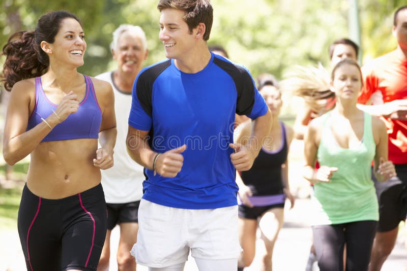 Group of Runners Jogging through Park Stock Image - Image of hobby ...