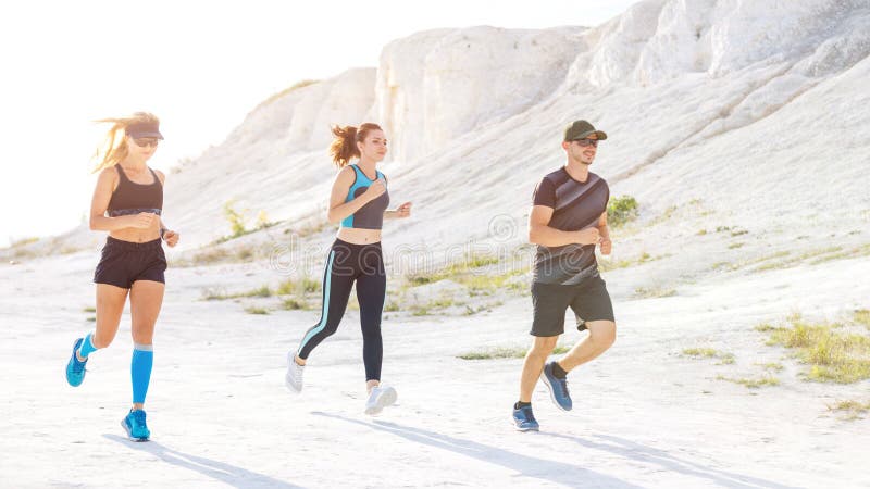 Group of Runners Run Outdoor Along the White Cliff Stock Photo - Image ...