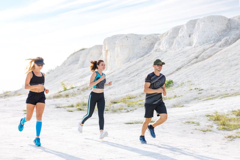 Group of Runners Run Outdoor Along the White Cliff Stock Image - Image ...