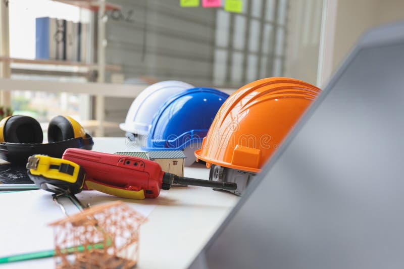Group of Safety Helmet on the Desk of Architectural at Construction ...