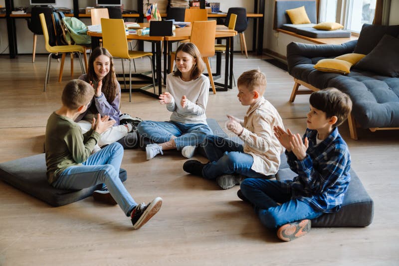 Group of Children Clapping Hands while Sitting in Library Stock Image ...
