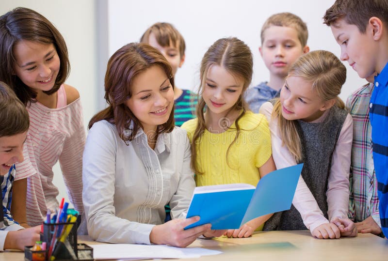 Group of School Kids with Teacher in Classroom Stock Photo - Image of ...