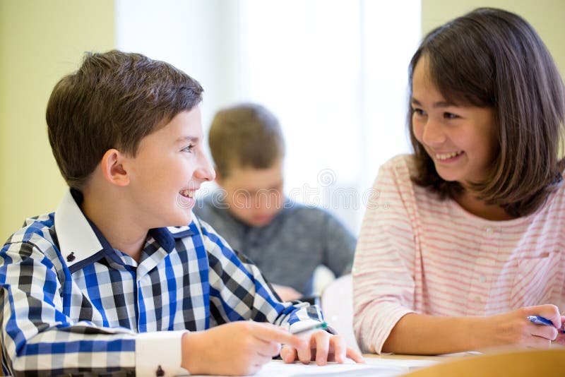 Group of School Kids Writing Test in Classroom Stock Photo - Image of ...