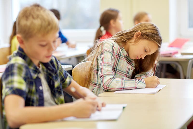 Group of School Kids Writing Test in Classroom Stock Photo - Image of ...