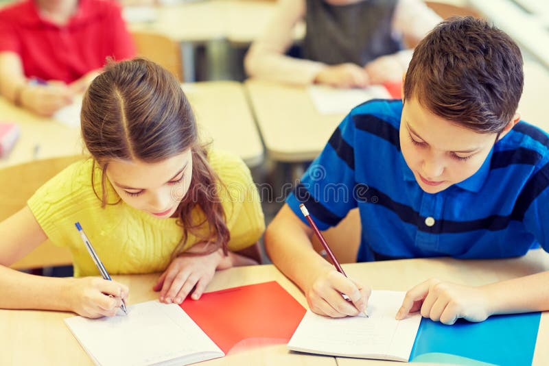 Group of School Kids Writing Test in Classroom Stock Photo - Image of ...