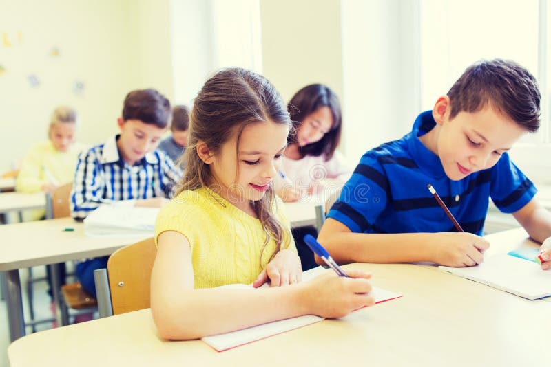 Group of School Kids Writing Test in Classroom Stock Photo - Image of ...
