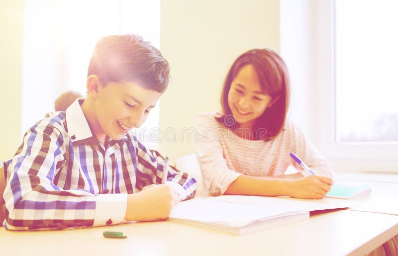 Group of School Kids Writing Test in Classroom Stock Photo - Image of ...
