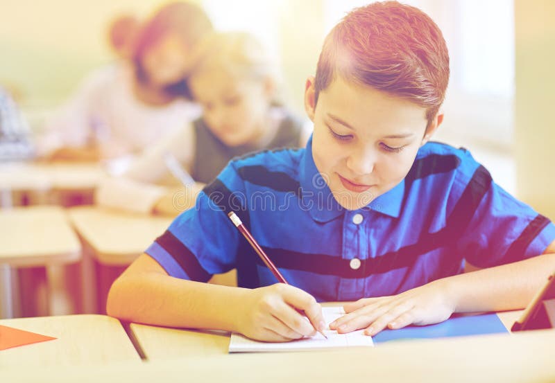 Group of School Kids Writing Test in Classroom Stock Photo - Image of ...