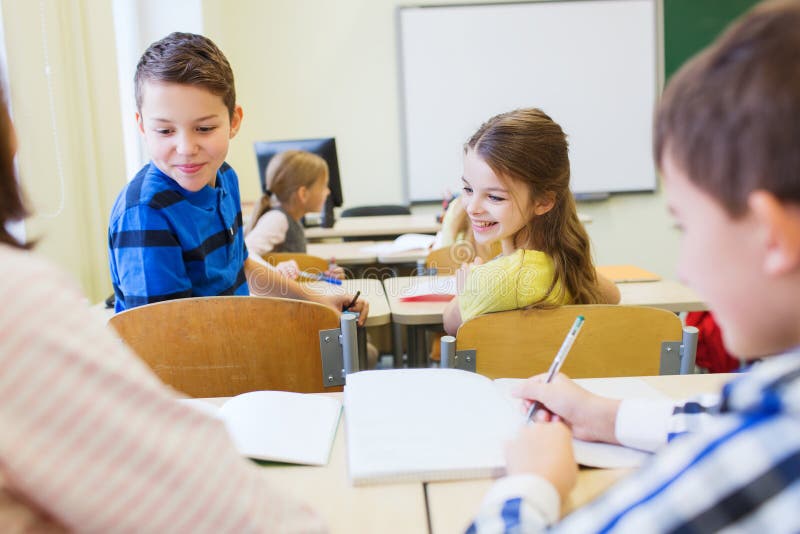 Group of School Kids Writing Test in Classroom Stock Photo - Image of ...