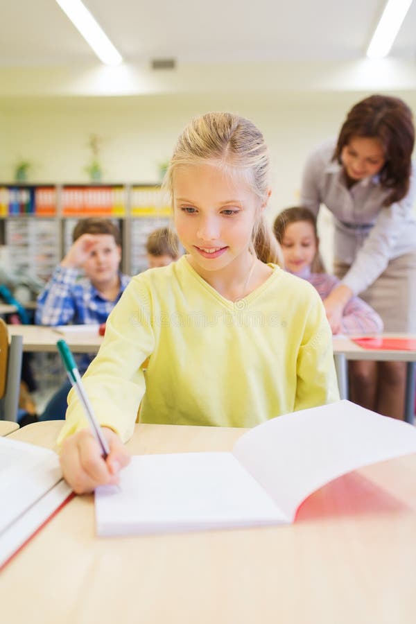 Group of School Kids Writing Test in Classroom Stock Image - Image of ...