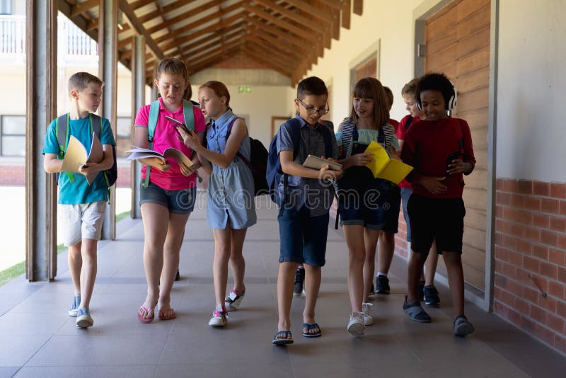 Group of School Pupils Walking in an Outdoor Corridor at Elementary ...