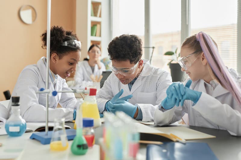 Group of Schoolchildren Enjoying Science Experiments in Class Stock ...