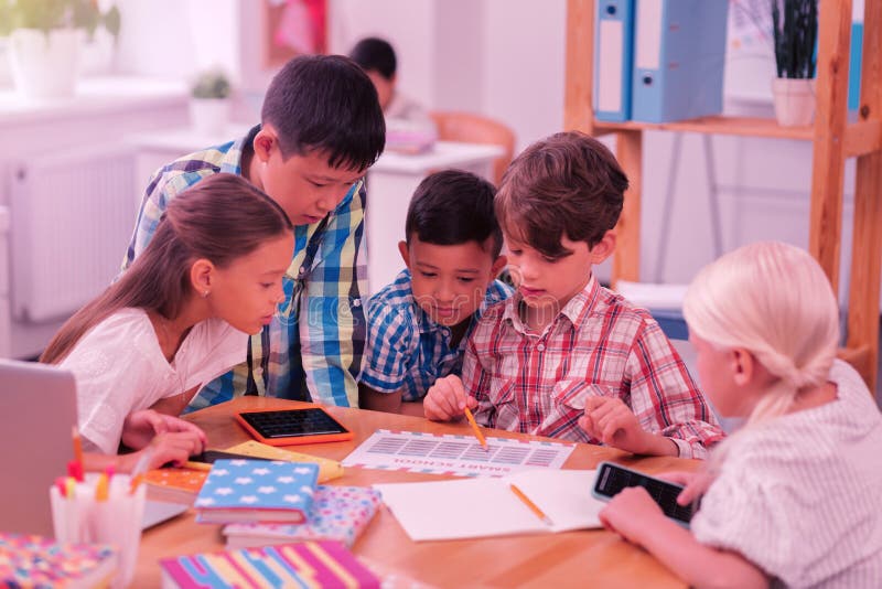 Group of Schoolchildren Exploring Their New Timetable. Stock Image ...
