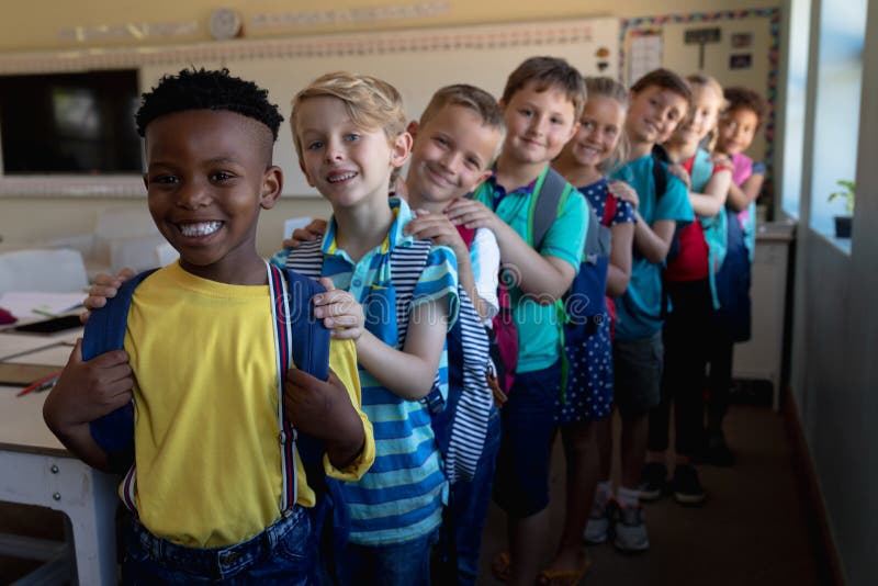 Group of Schoolchildren Walking Single File with Hands on Each Others ...