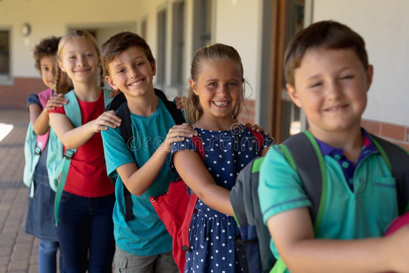 Group of Schoolchildren Walking Single File with Hands on Each Others ...