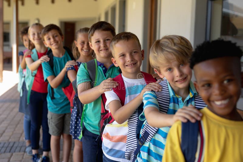 Group of Schoolchildren Walking Single File with Hands on Each Others ...
