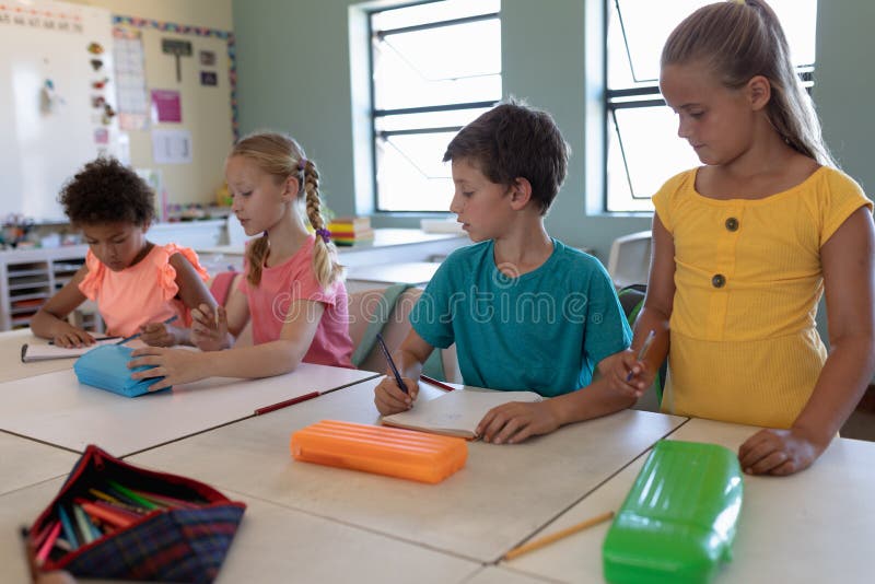 Group of Schoolchildren Working in an Elementary School Classroom Stock ...