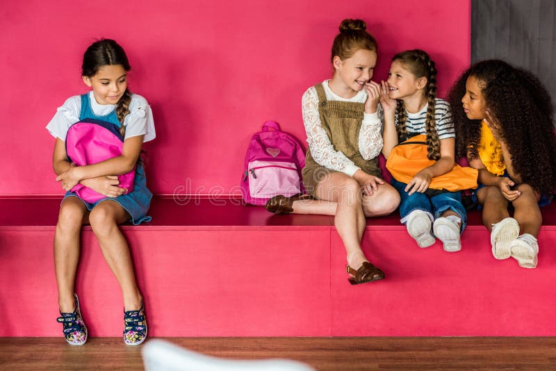 Group of Schoolgirls Laughing and Gossiping on Their Classmate Stock ...