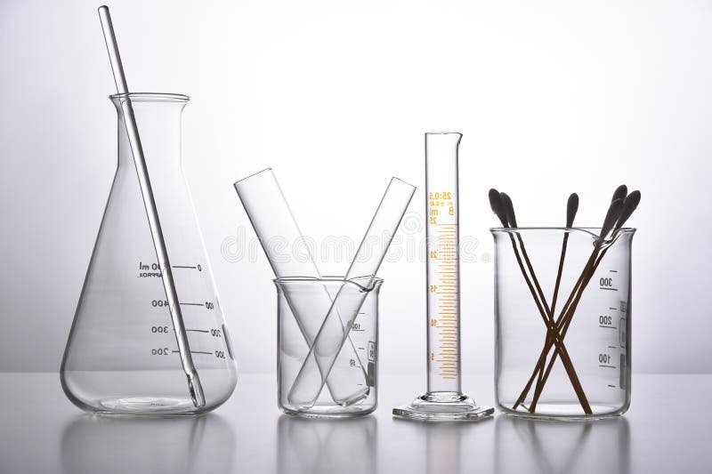 Group of Scientific Laboratory Glassware with Clear Liquid Solution ...