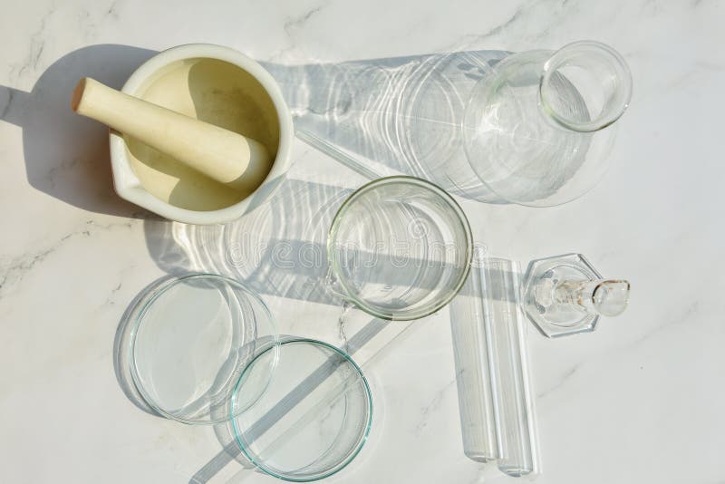 Group of Scientific Laboratory Glassware with Clear Liquid Solution ...