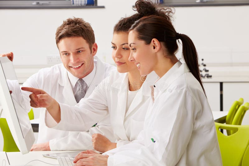 Group of Scientists Checking Laboratory Results on Computer Stock Photo ...