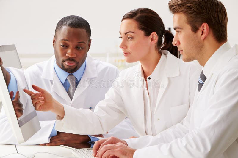 Group of Scientists Checking Laboratory Results on Computer Stock Photo ...