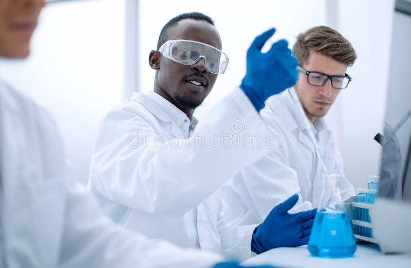 Group of Scientists are Conducting Experiments with the Liquid Stock ...