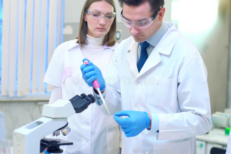A Group of Scientists Conducts Research in a Scientific Laborato Stock ...