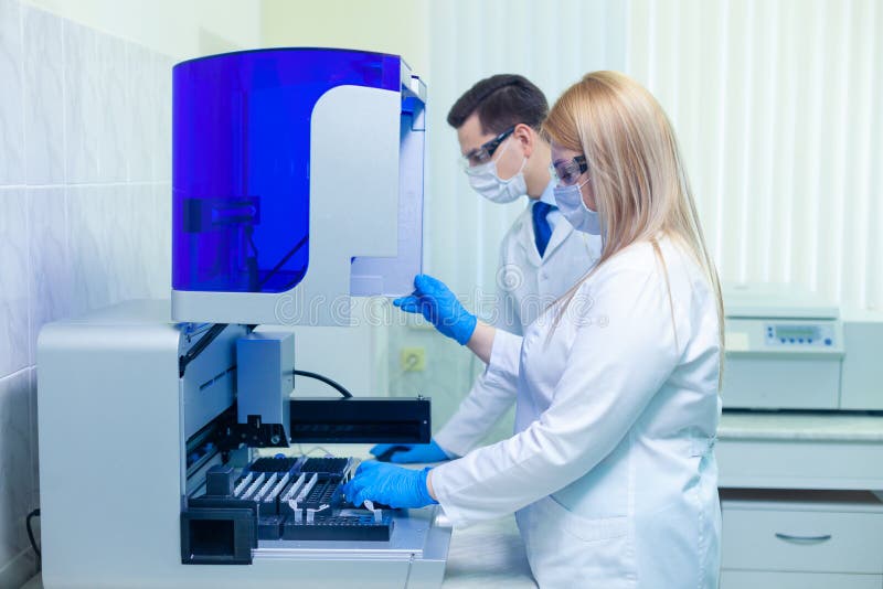 A Group of Scientists Conducts Research in a Scientific Laboratory ...