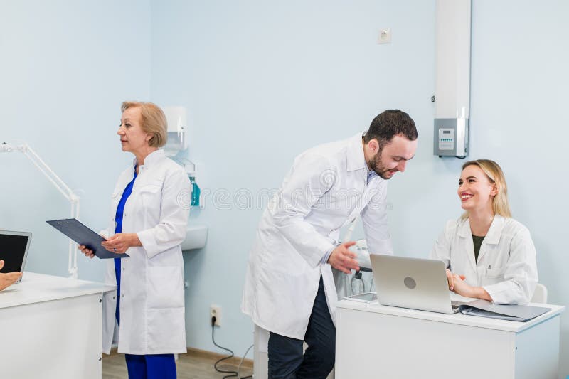 A Group of Scientists Conducts Research in a Scientific Laboratory ...
