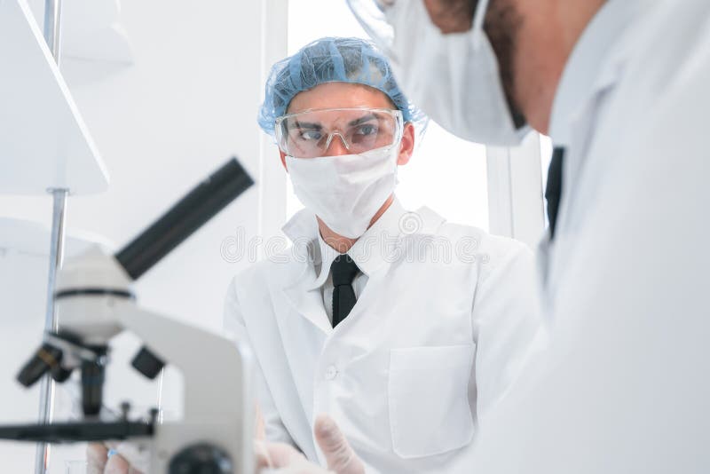 Group of Scientists Discussing the Results of Testing. Stock Photo ...