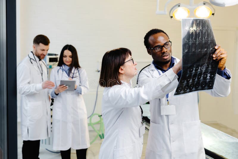 Group of Scientists Examining Data on Paper Stock Image - Image of ...