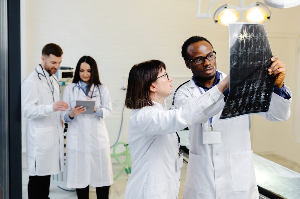 Group of Scientists Examining Data on Paper Stock Image - Image of ...
