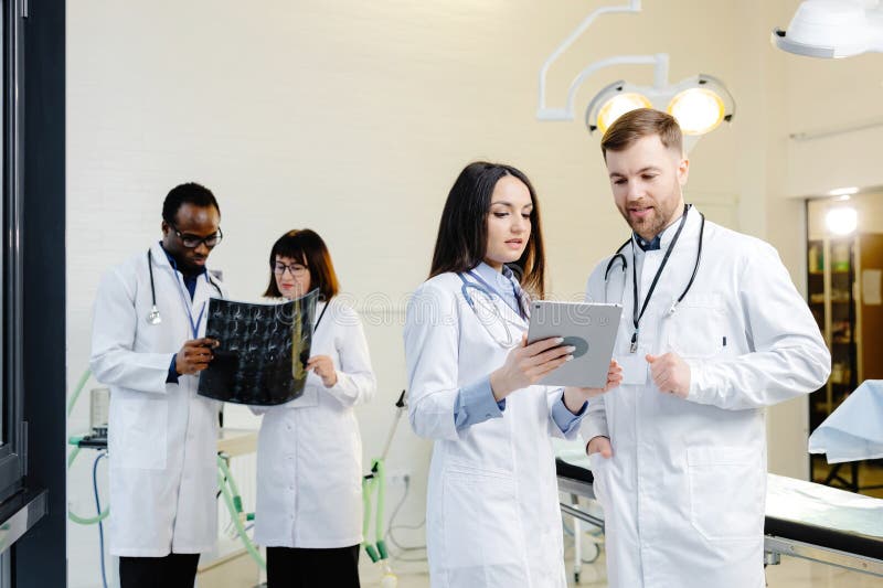 Group of Scientists Examining Data on Paper. Stock Photo - Image of ...