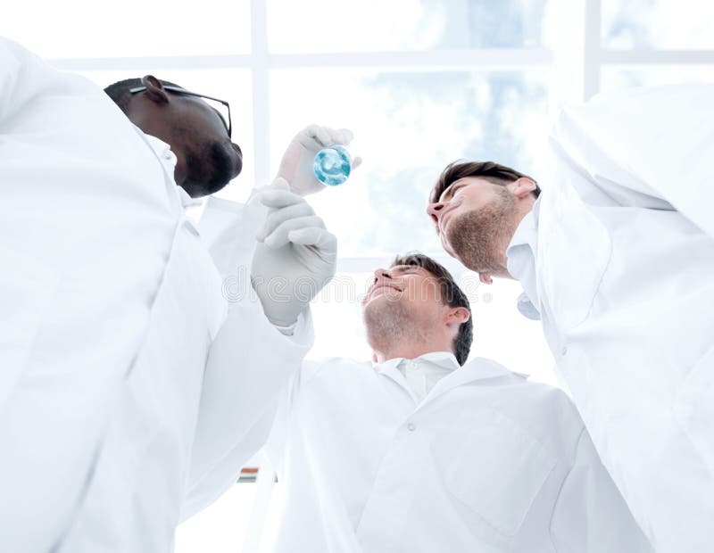 Group of Scientists Looking at the Results of Their Experiment. Stock ...