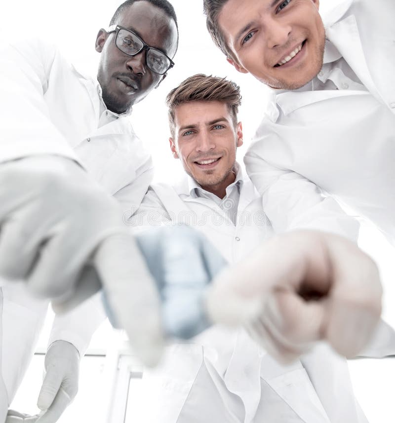 Group of Scientists Pointing To the Laboratory Table Stock Photo ...