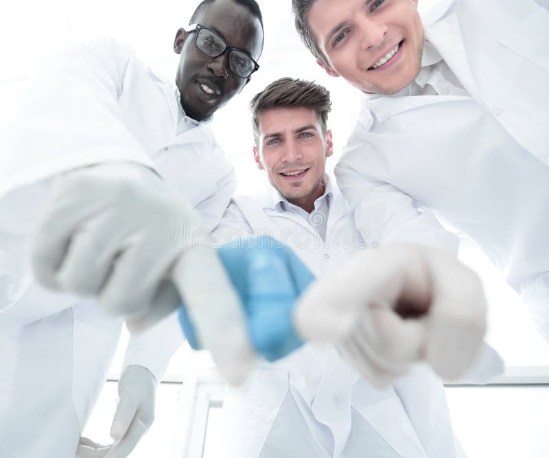 Group of Scientists Pointing To the Laboratory Table Stock Photo ...