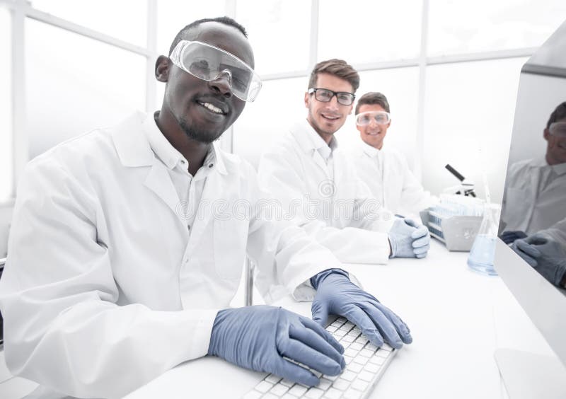 Group of Scientists Sitting at the Laboratory Table Stock Photo - Image ...