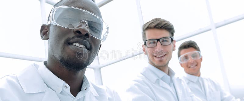 Group of Scientists Sitting at the Laboratory Table Stock Image - Image ...