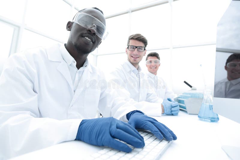 Group of Scientists Sitting at the Laboratory Table Stock Image - Image ...