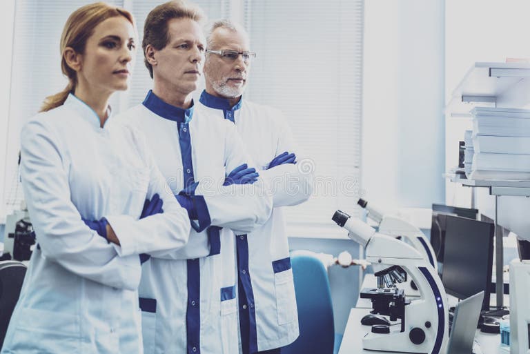 Group of Scientists Standing in Line Stock Photo - Image of genetics ...