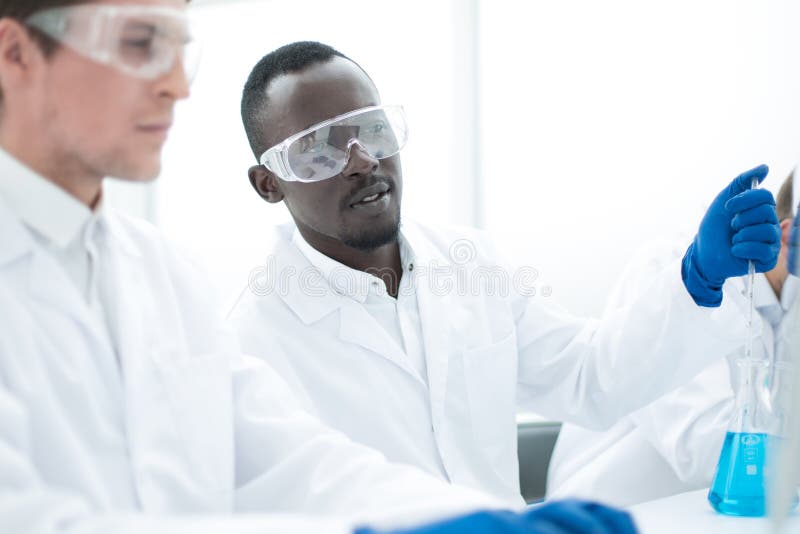 Group of Scientists Using a Computer To Enter Data Stock Image - Image ... Group of Scientists Using a Computer To Enter Data Stock Image - Image ...