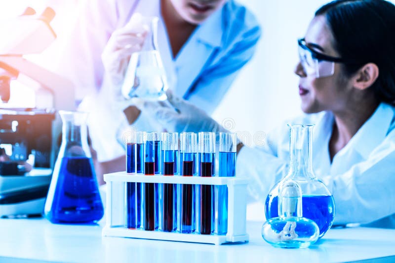 Group of Scientists Working in Chemical Lab. Stock Photo - Image of ...
