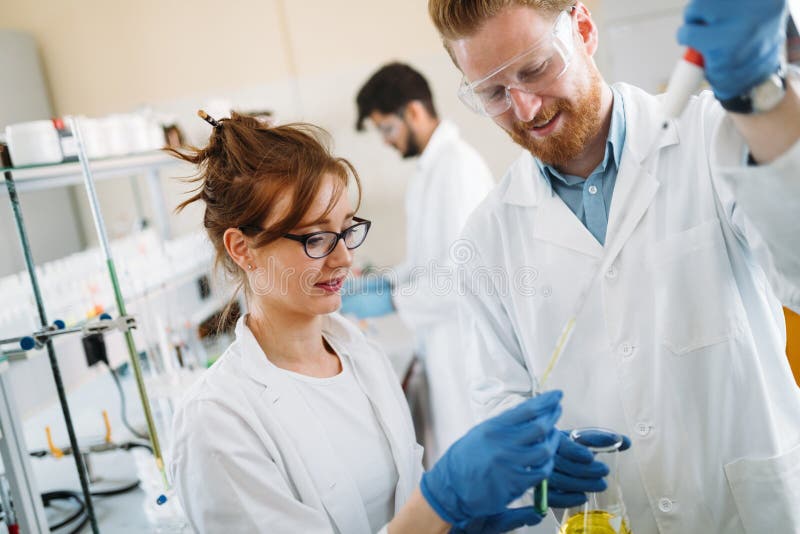 Group of Scientists Working at Laboratory Stock Photo - Image of ...