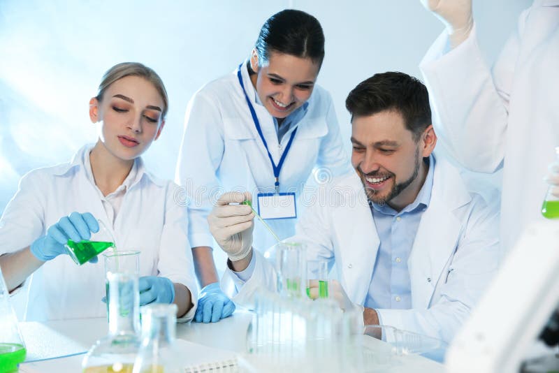 Group of Scientists Working with Sample in Chemistry Laboratory Stock ...