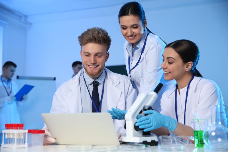 Group of Scientists Working with Sample in Chemistry Laboratory Stock ...