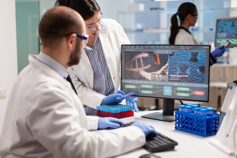 Group of Scientists Working in Modern Equipped Laboratory Stock Image ...