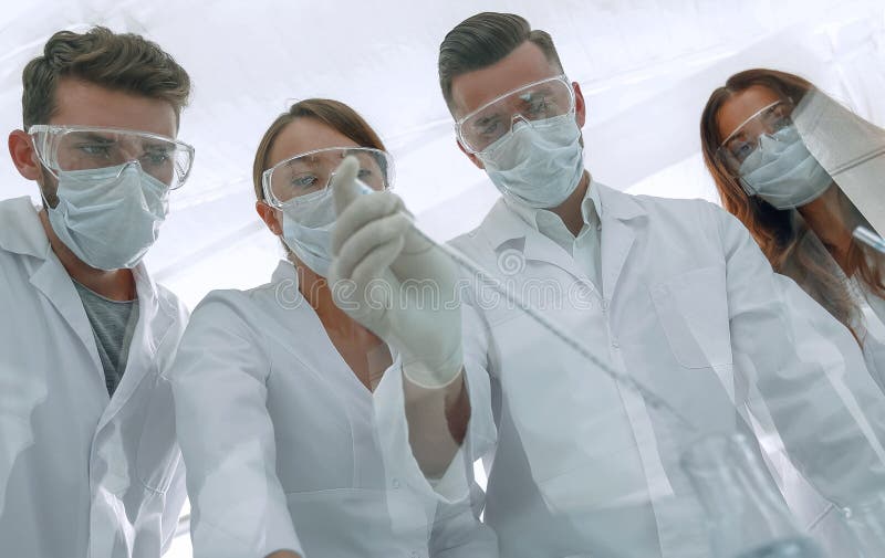Scientists Working with Test Tubes and Microscope in the Laboratory ... Scientists Working with Test Tubes and Microscope in the Laboratory ...