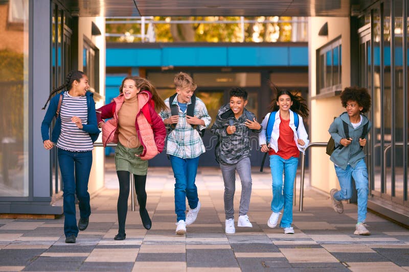 Group of Secondary or High School Pupils Running Towards Camera Outside ...
